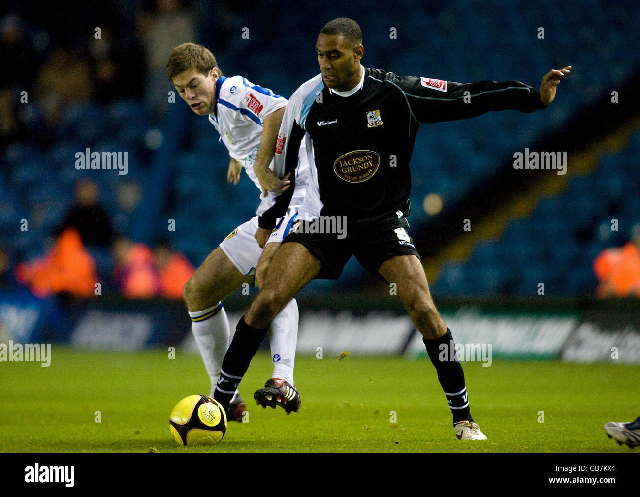 Leeds United's Jonathan Howson and Northampton Town's Leon Constanine ...
