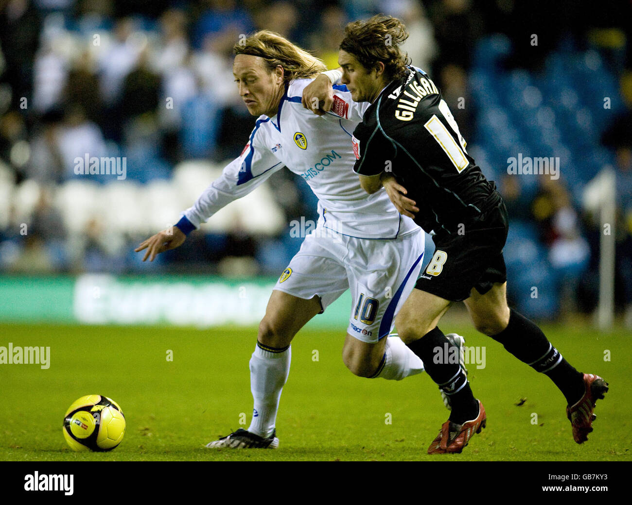 Leeds United's Luciano Becchio is held back by Northampton Town's Ryan ...