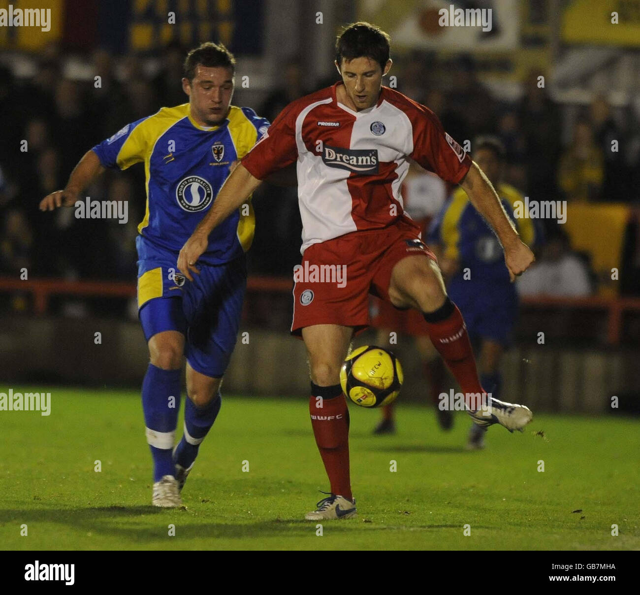 Wycombe Mike Williamson (right) and AFC Wimbledon's Danny Kedwell ...
