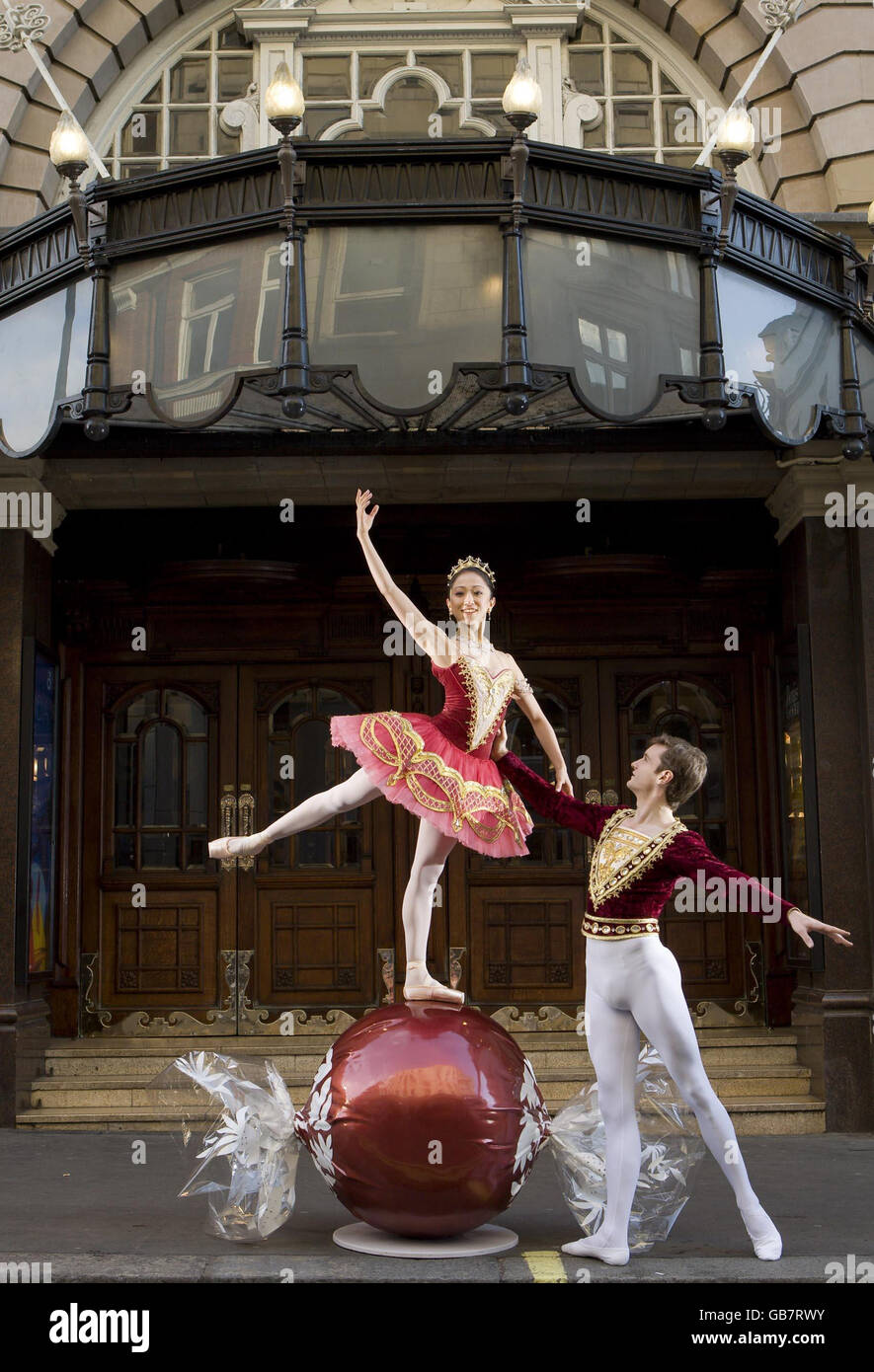 Dancers from the English National Ballet pose with a giant model of a ...