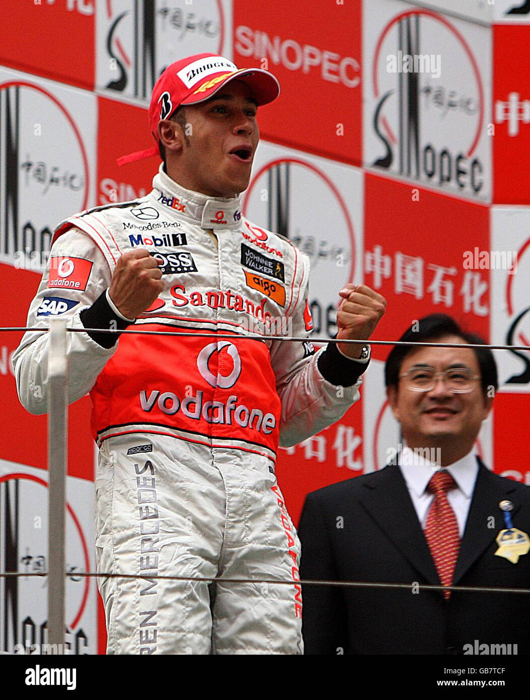 McLaren Mercedes' Lewis Hamilton celebrates his victory following the ...