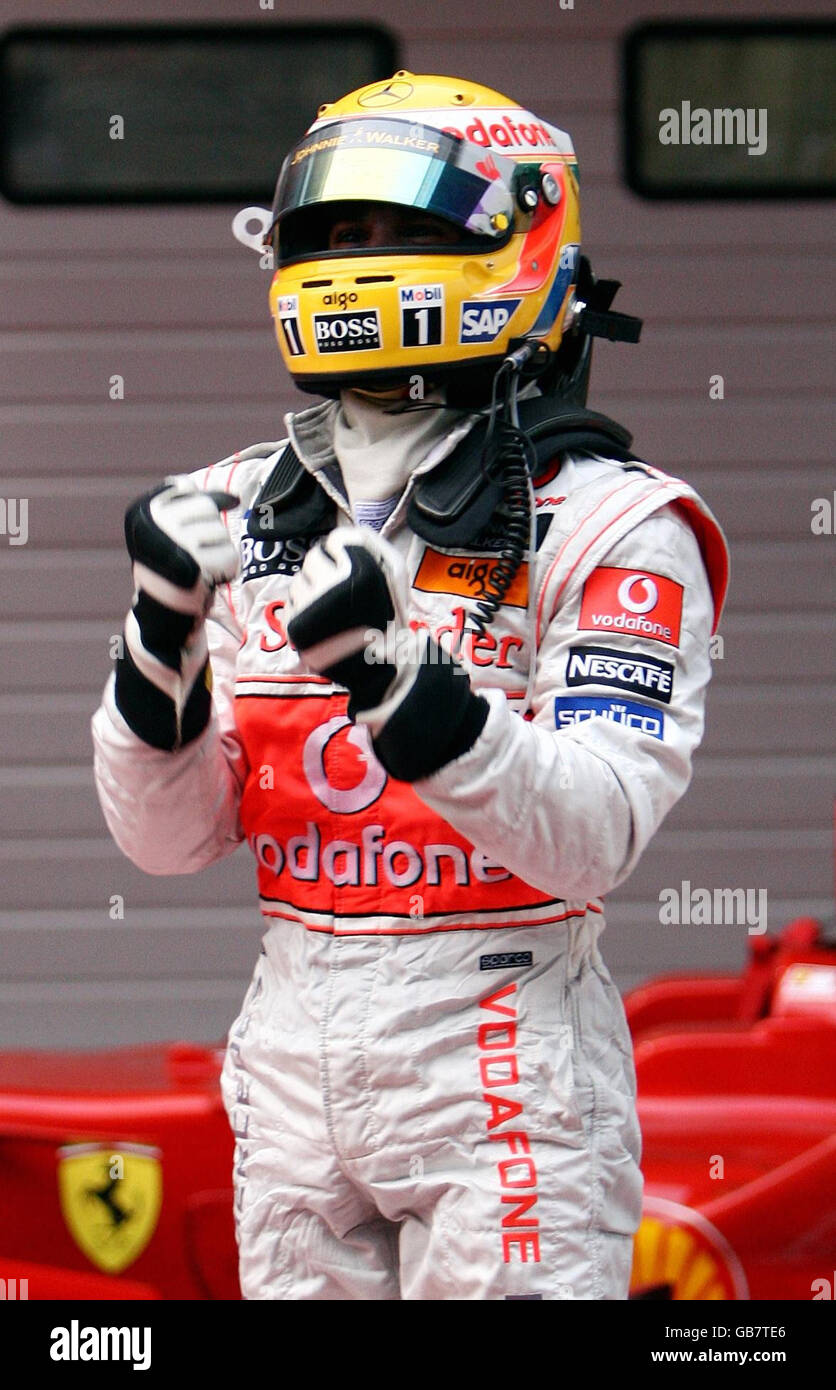 McLaren Mercedes' Lewis Hamilton celebrates his victory during the ...