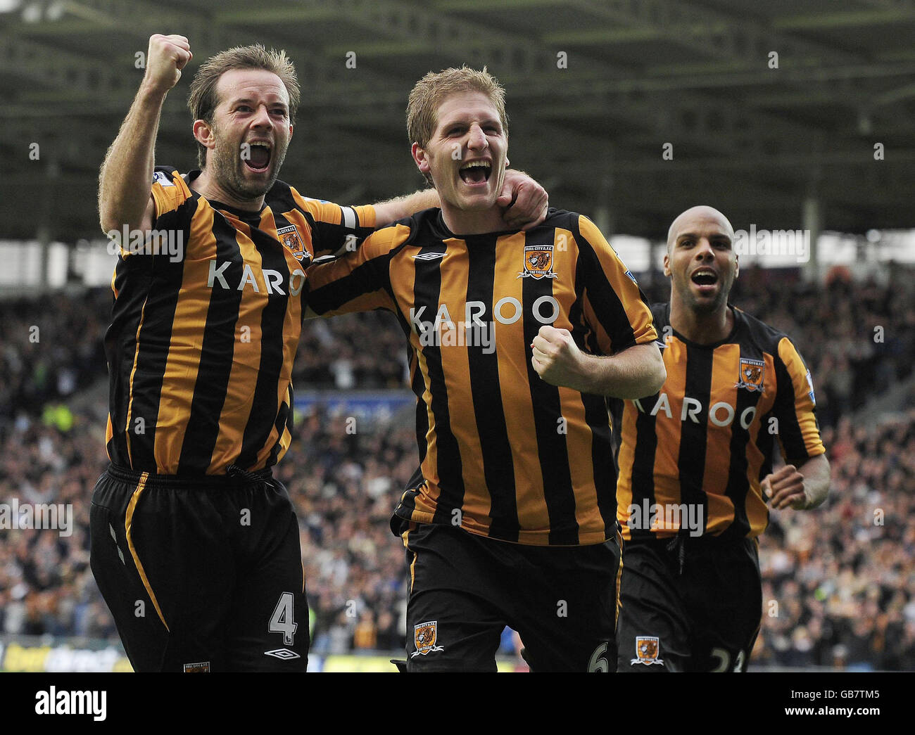 Hull City's Michael Turner (centre) celebrates his goal with Ian Ashbee ...
