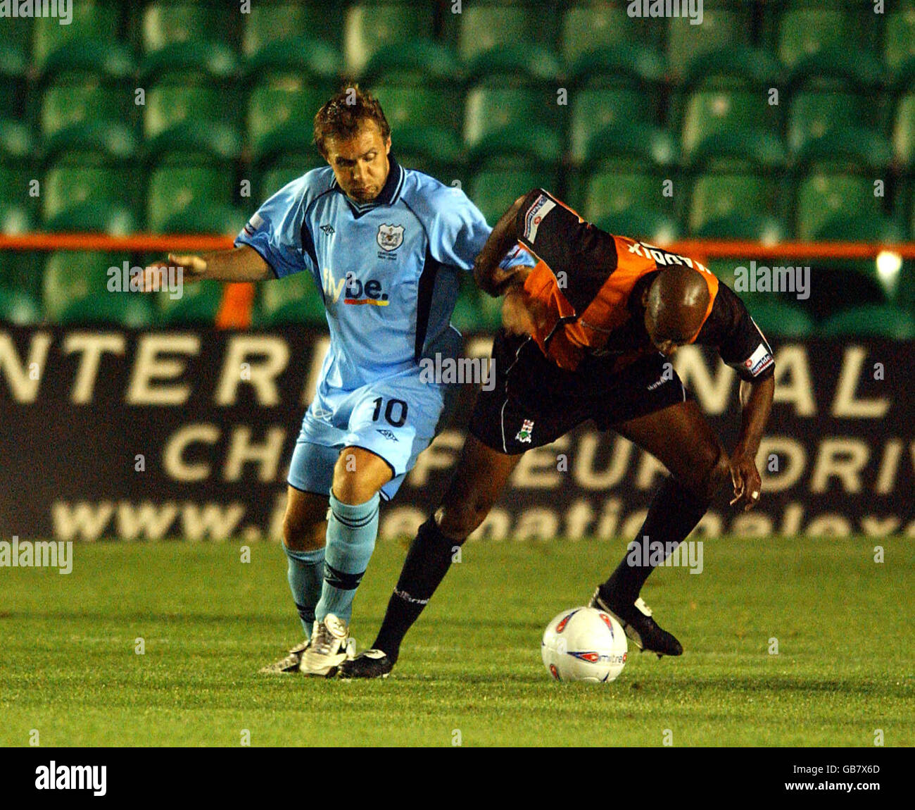 Barnet's Danny Maddix battles with Exeter City's Sean Devine Stock ...