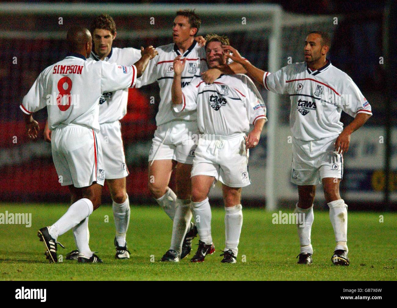 Telford United's Tony Naylor (c) celebrates with Fitzroy Simpson (l ...
