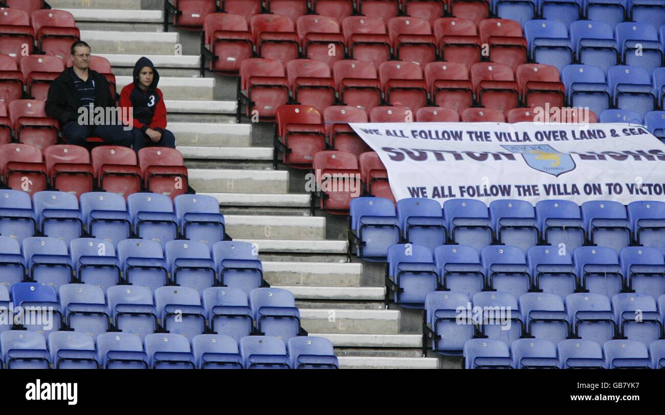 Two fans sit in an empty stand hi-res stock photography and images - Alamy