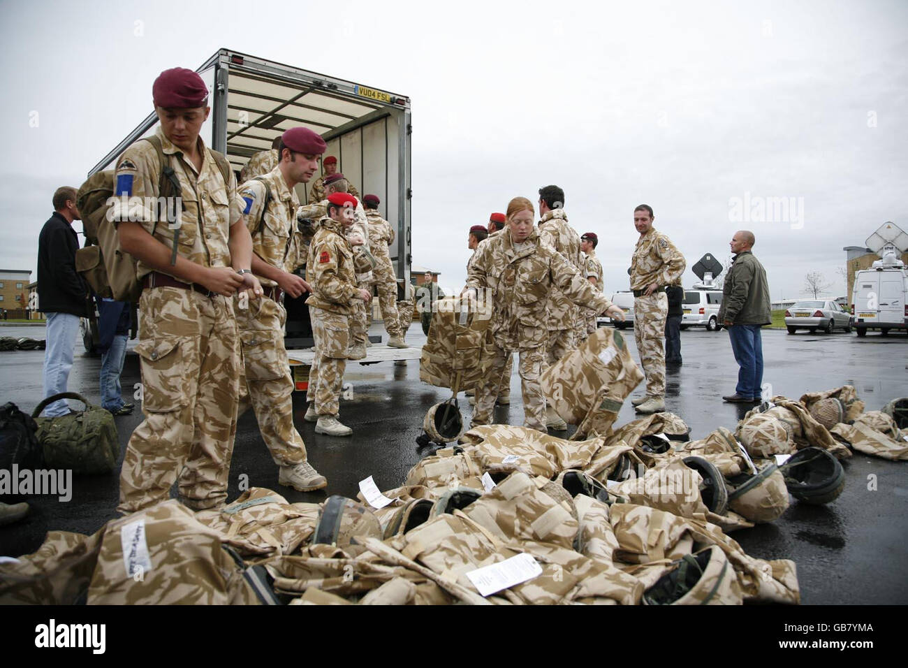 Members of the 2nd Battalion, the Parachute Regiment, unload their kit ...