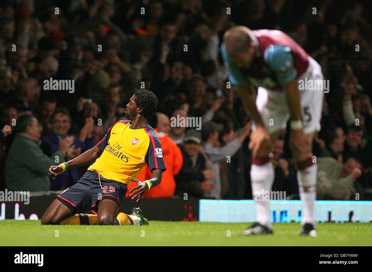 Arsenal's Emmanuel Adebayor (l) celebrates as West Ham United's Matthew ...