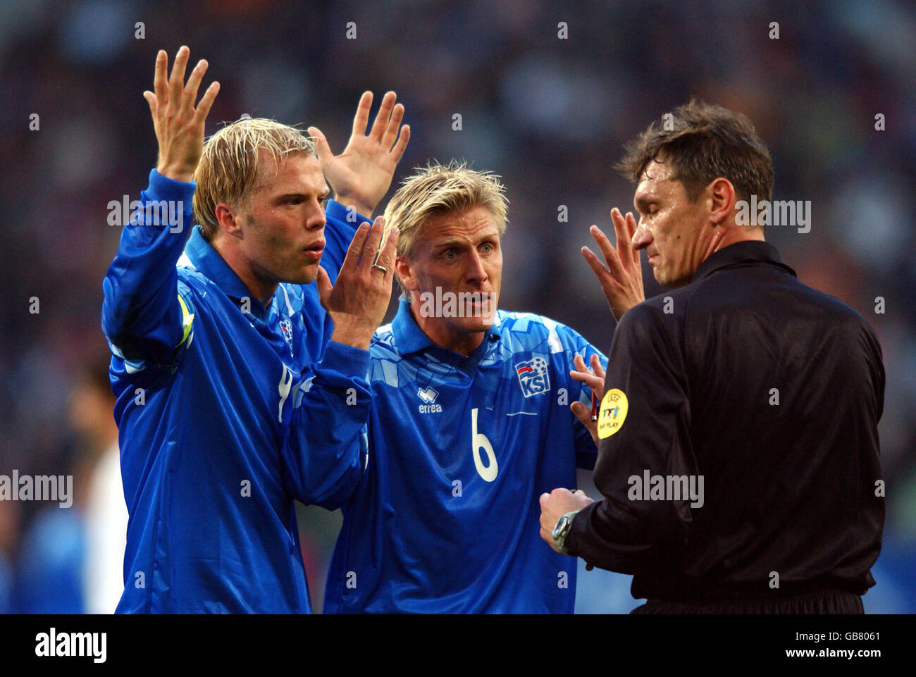 Iceland's Eidur Gudjohnsen and Runar Kristinsson complain to referee ...