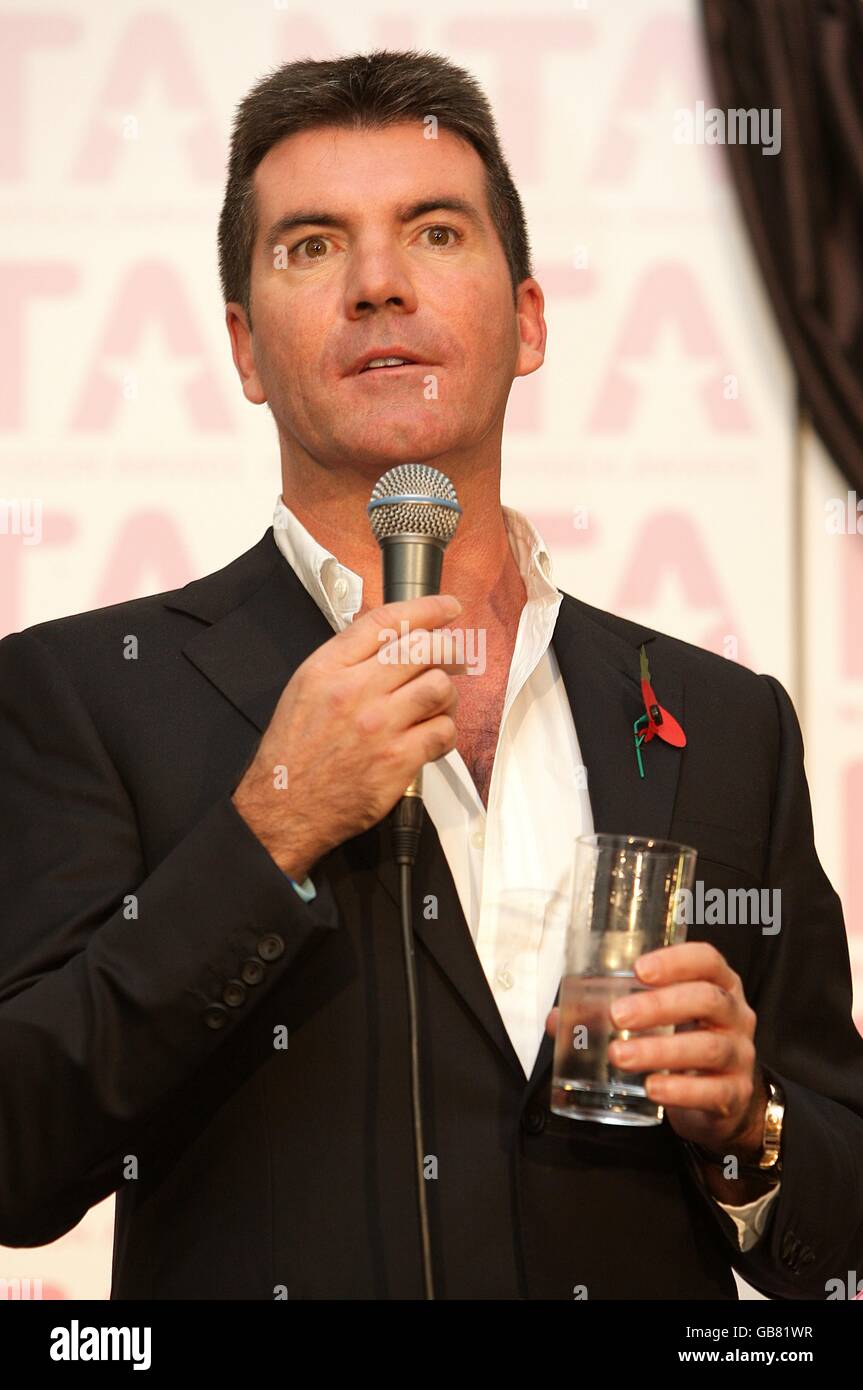 Simon Cowell makes a speech after winning the Special Recognition Award ...