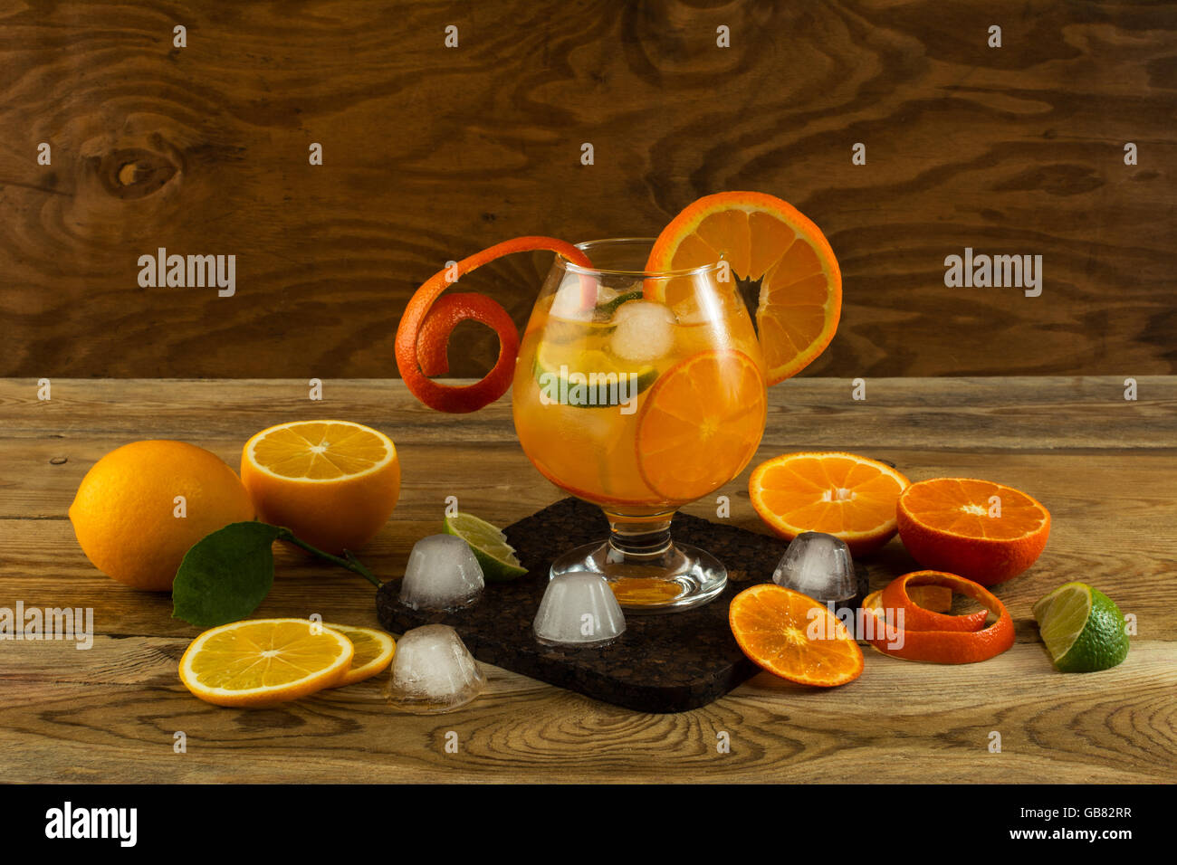 Citrus lemonade on wooden background. Fruit cocktail. Fruit drink ...