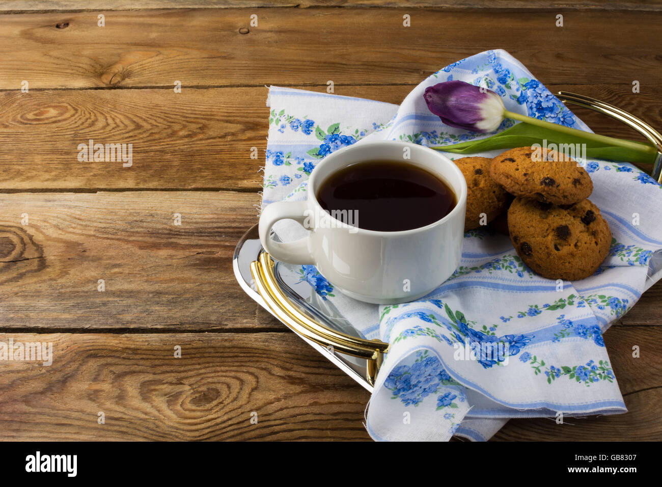 Cup of tea and cookies on tea tray. Breakfast cookies. Sweet pastry ...