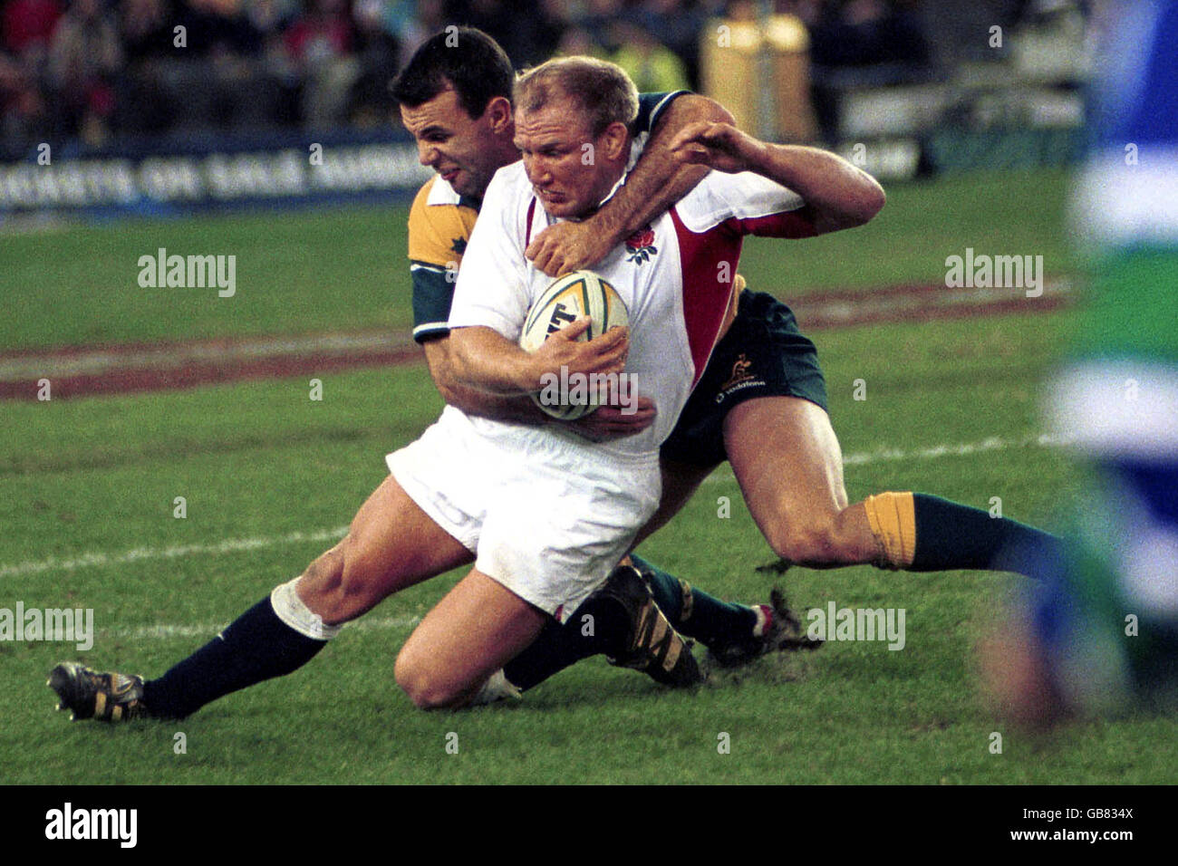 Australias joe roff behind takes down englands neil back front hi-res ...