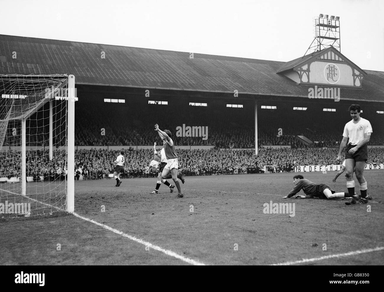 David Court, the Arsenal centre forward, left, follows up a shot which ...