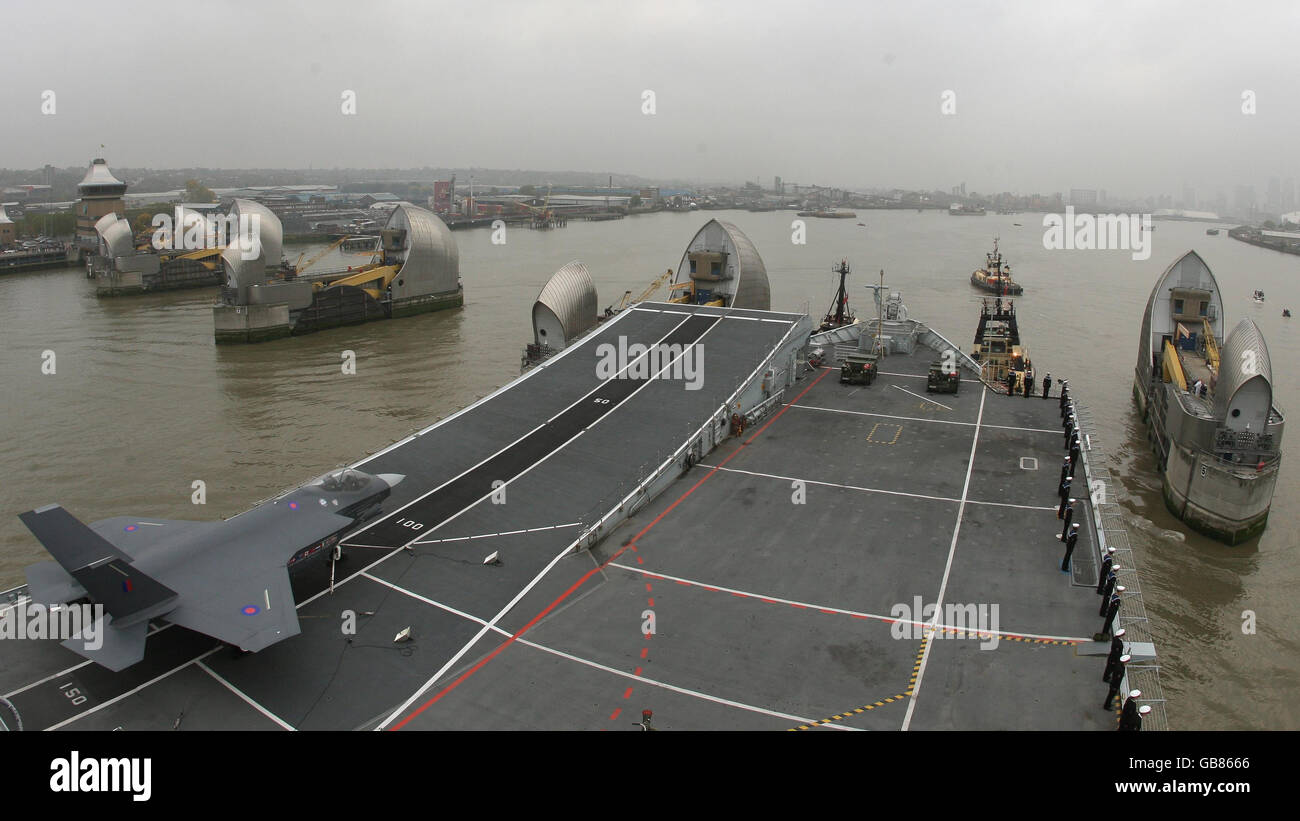 The Royal Navy aircraft carrier HMS Illustrious passes through the ...