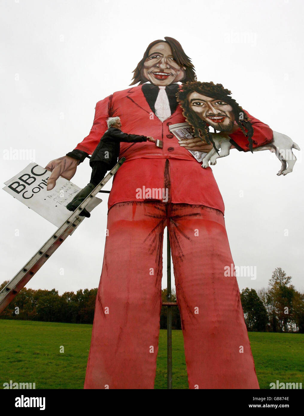 Artist Frank Shepherd puts the finishing touches to an effigy of ...