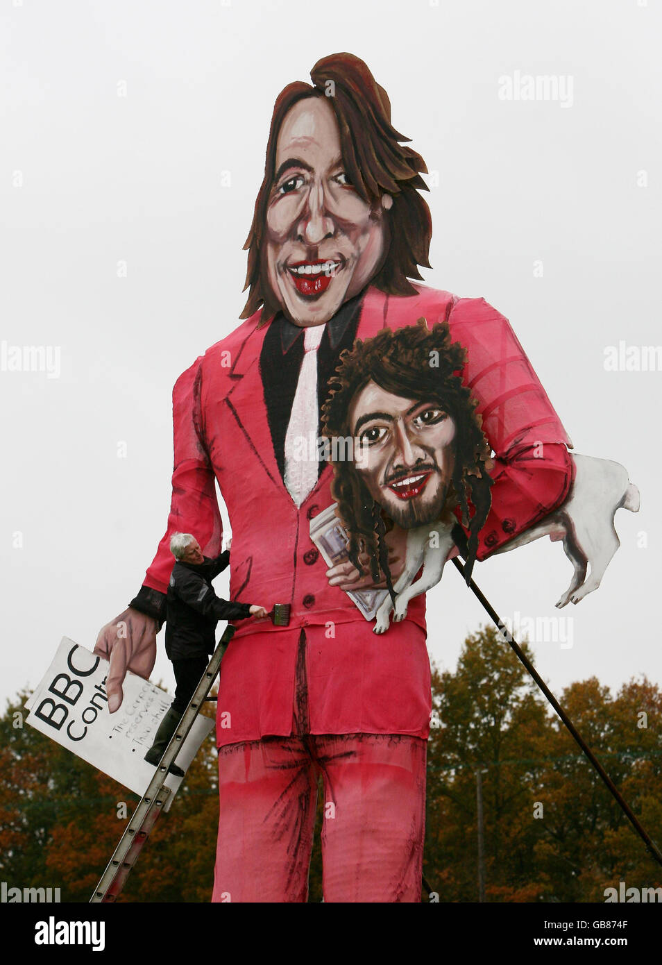 Artist Frank Shepherd puts the finishing touches to an effigy of ...