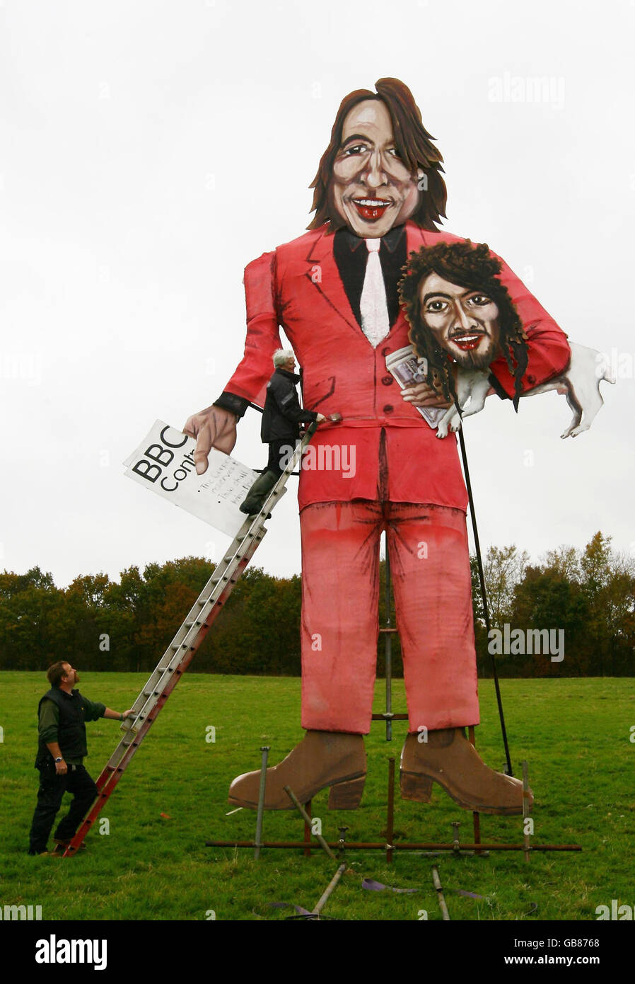 Artist Frank Shepherd (top) puts the finishing touches to an effigy of ...