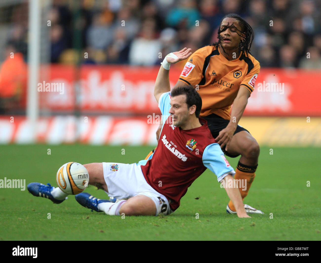 Wolverhampton Wanderers' Michael Mancienne and Burnley's Robbie Blake ...