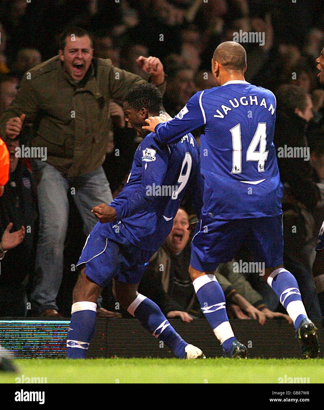 Everton's Louis Saha (l) celebrates scoring his sides second goal Stock ...