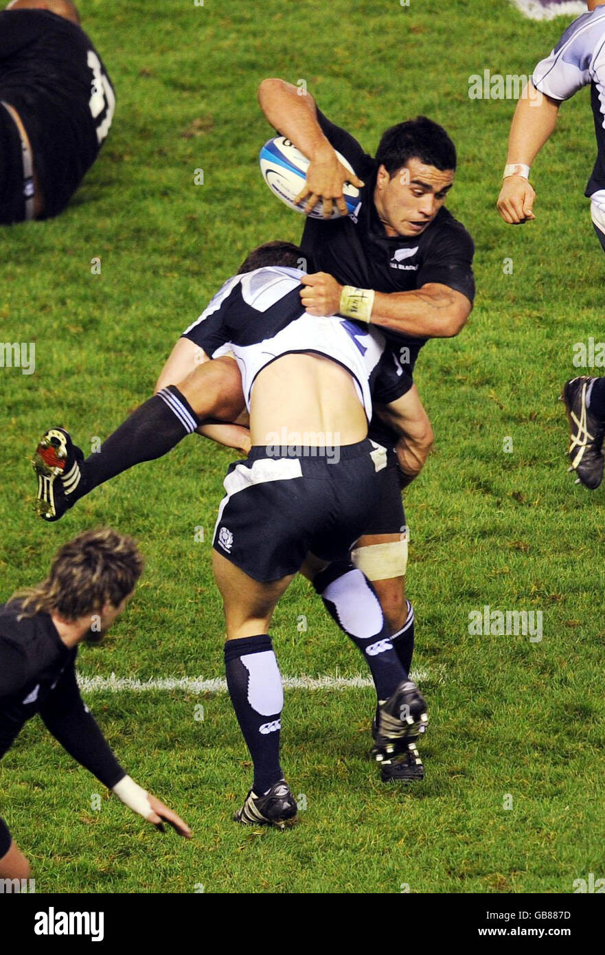 Scotland's Nick De Luca tackles New Zealand's Liam Messan during the ...