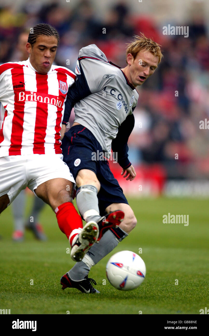 Stoke City's Darel Russel gets a foot in to tackle Crewe Alexandra's ...