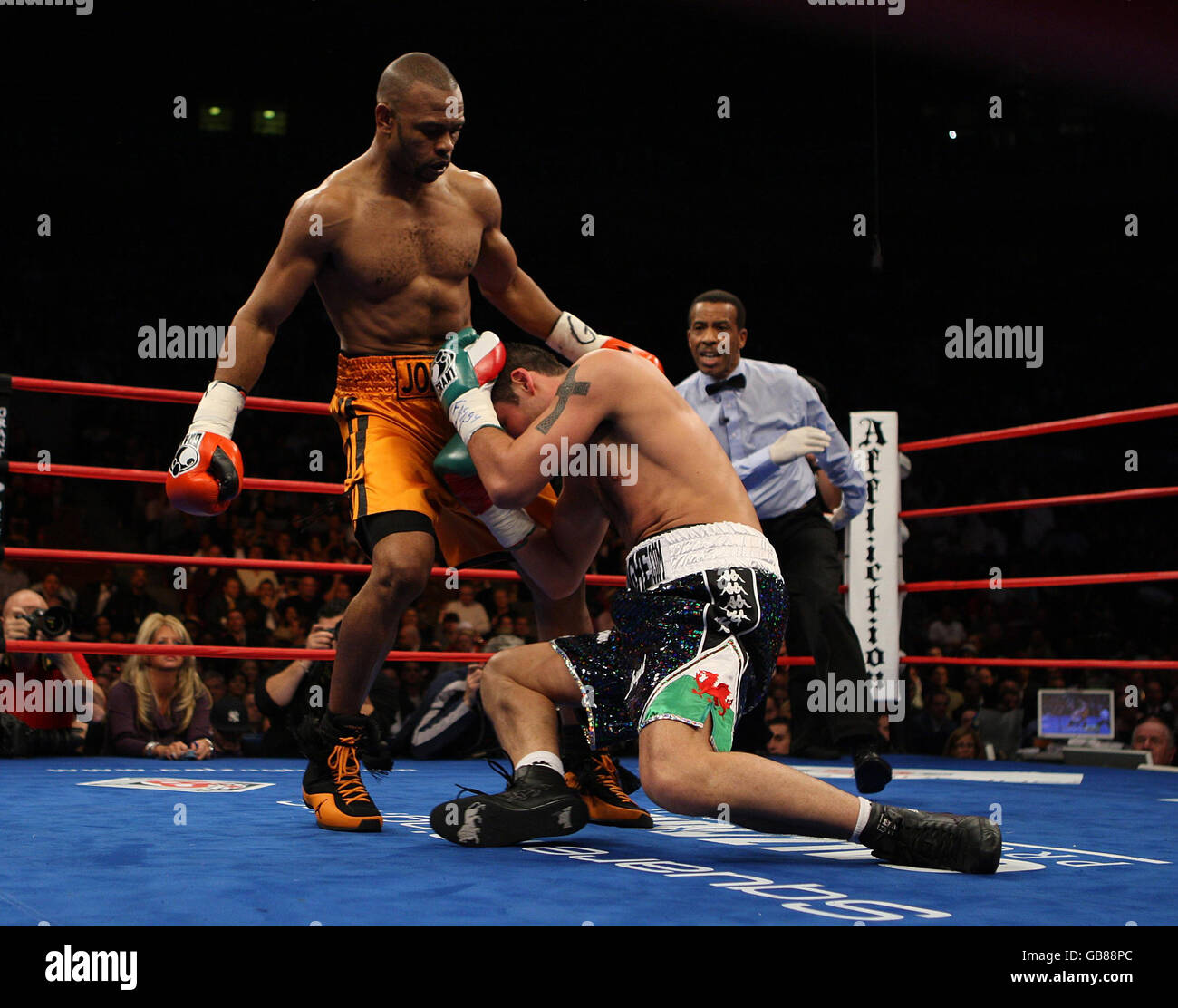 Wales' Joe Calzaghe is knocked down in the 1st round against USA's Roy ...