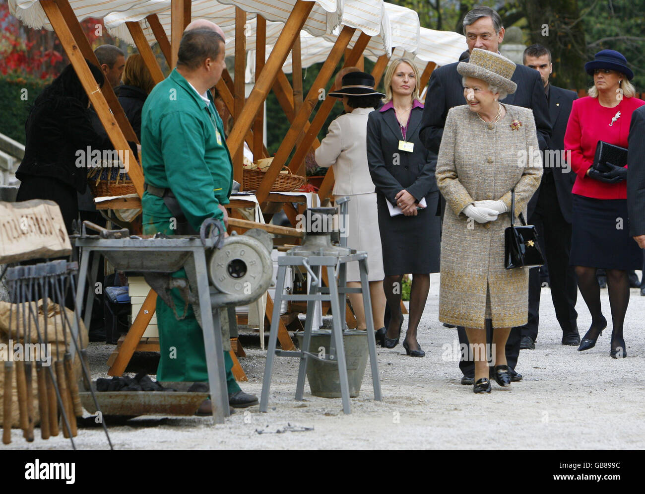 Britain's Queen Elizabeth II meets a blacksmith at the Lipica Stud ...