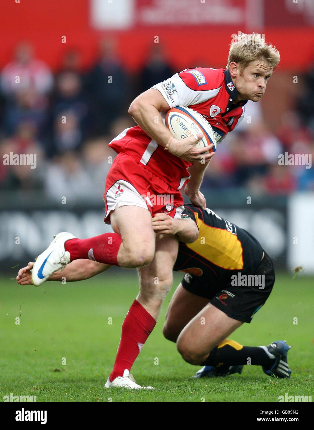 Gloucester's Iain Balshaw is tackled by Dragons Ashley Smith during the ...