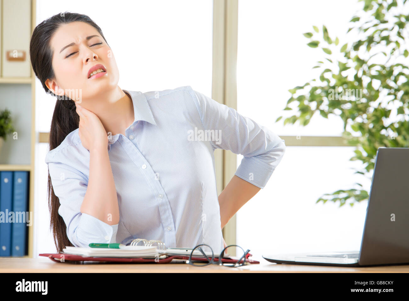 Young indian woman back pain hi-res stock photography and images - Alamy