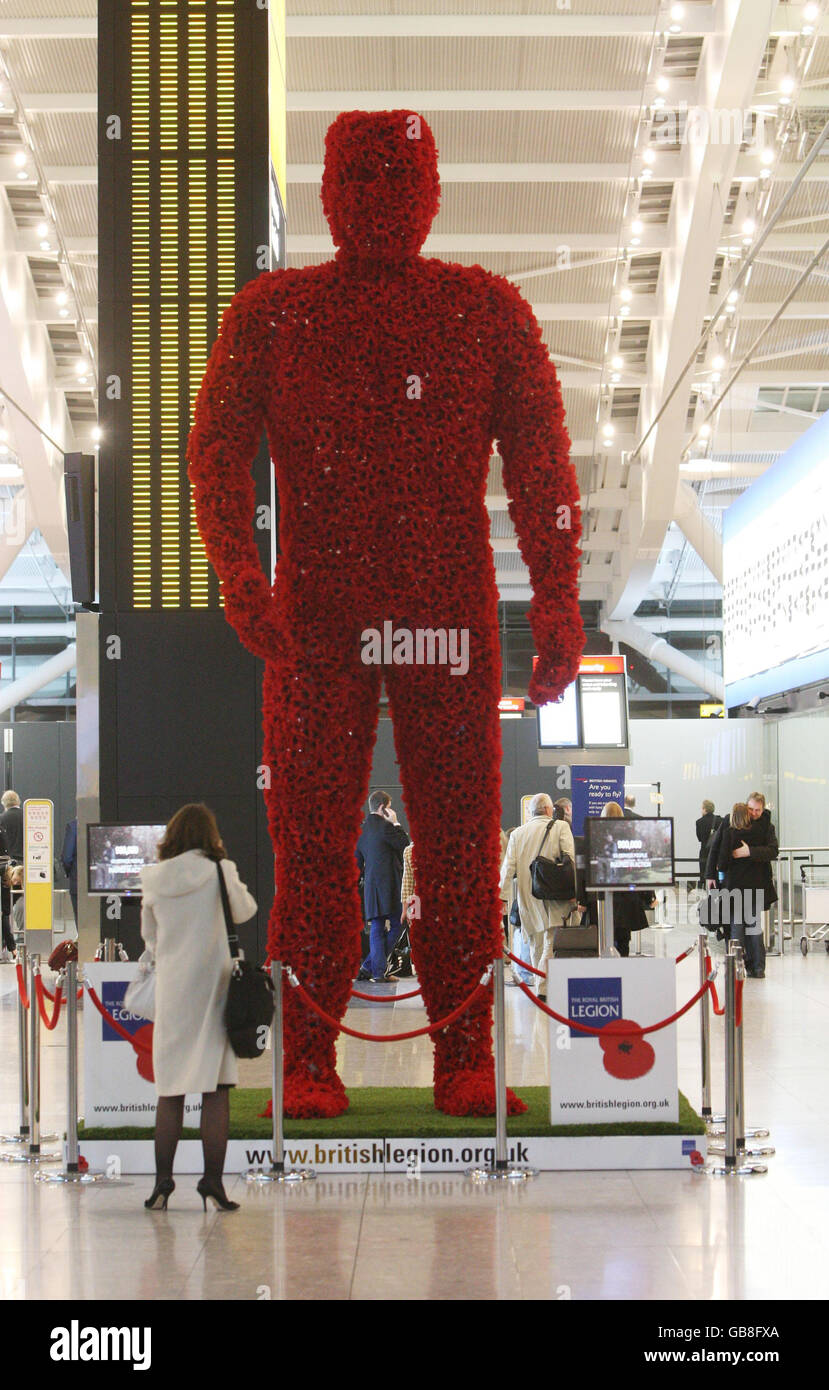 Metre tall poppy man in departures area terminal heathrow airport hi ...