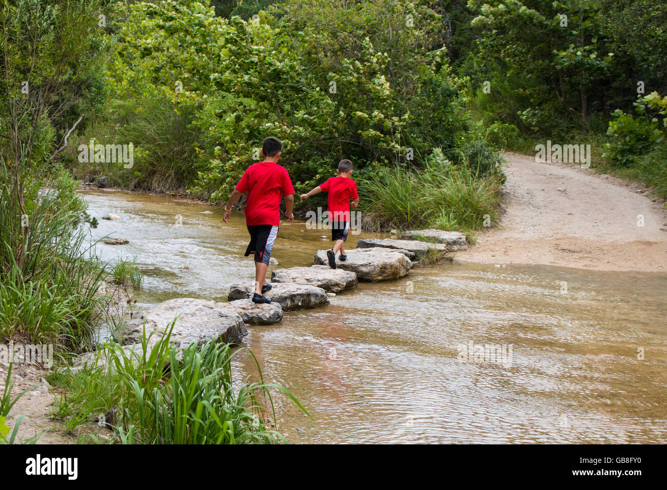 Children crossing creek at Lost Maples State Natural Area- Vanderpool ...