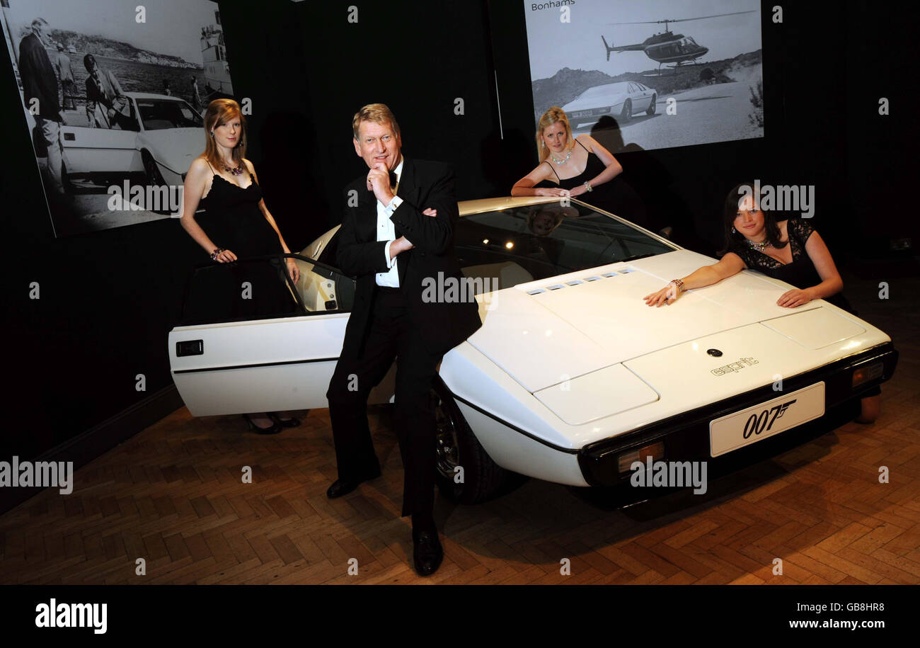 Bonhams staff pose with the white 1976 Lotus Esprit from the 1977 Bond ...
