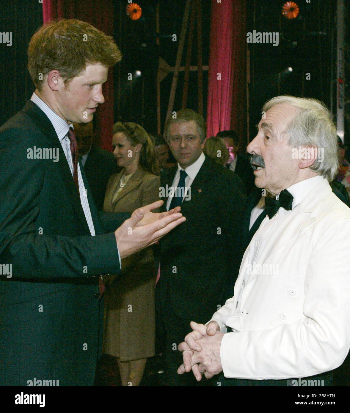 Prince Harry talks to Andrew Sachs backstage at the Wimbledon Theatre ...