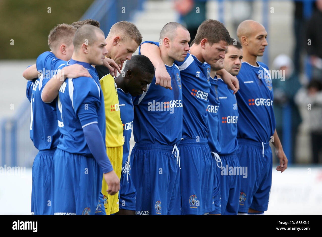 Curzon Ashton's players observe a minutes silence in honour of ...