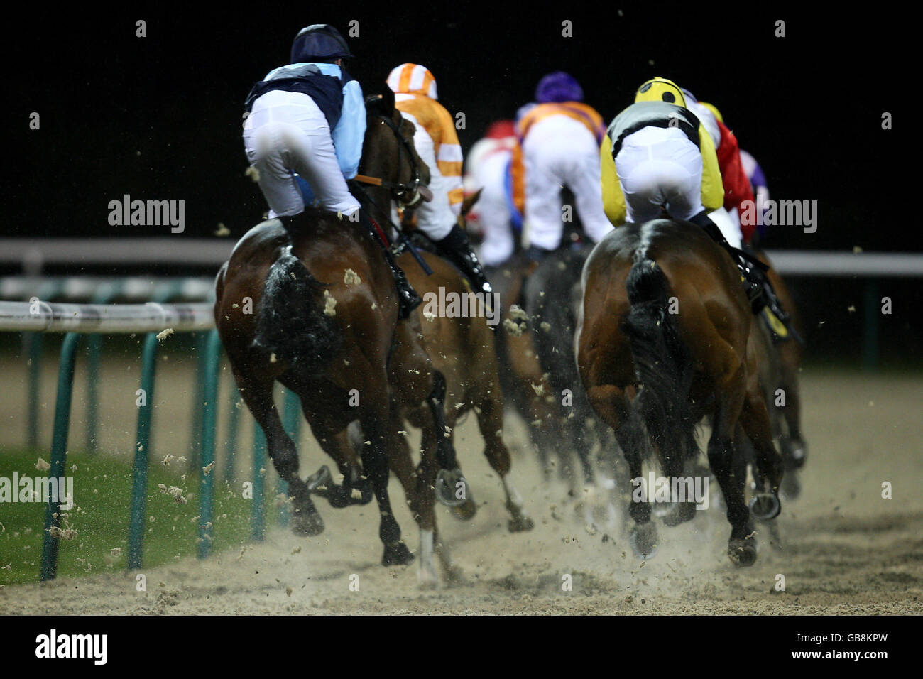 Horse Racing - Wolverhampton Racecourse. Horses make their way round ...