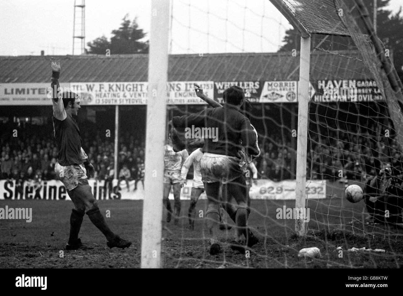 Ray Kennedy of Arsenal raises his arm in triumph after seeing John ...