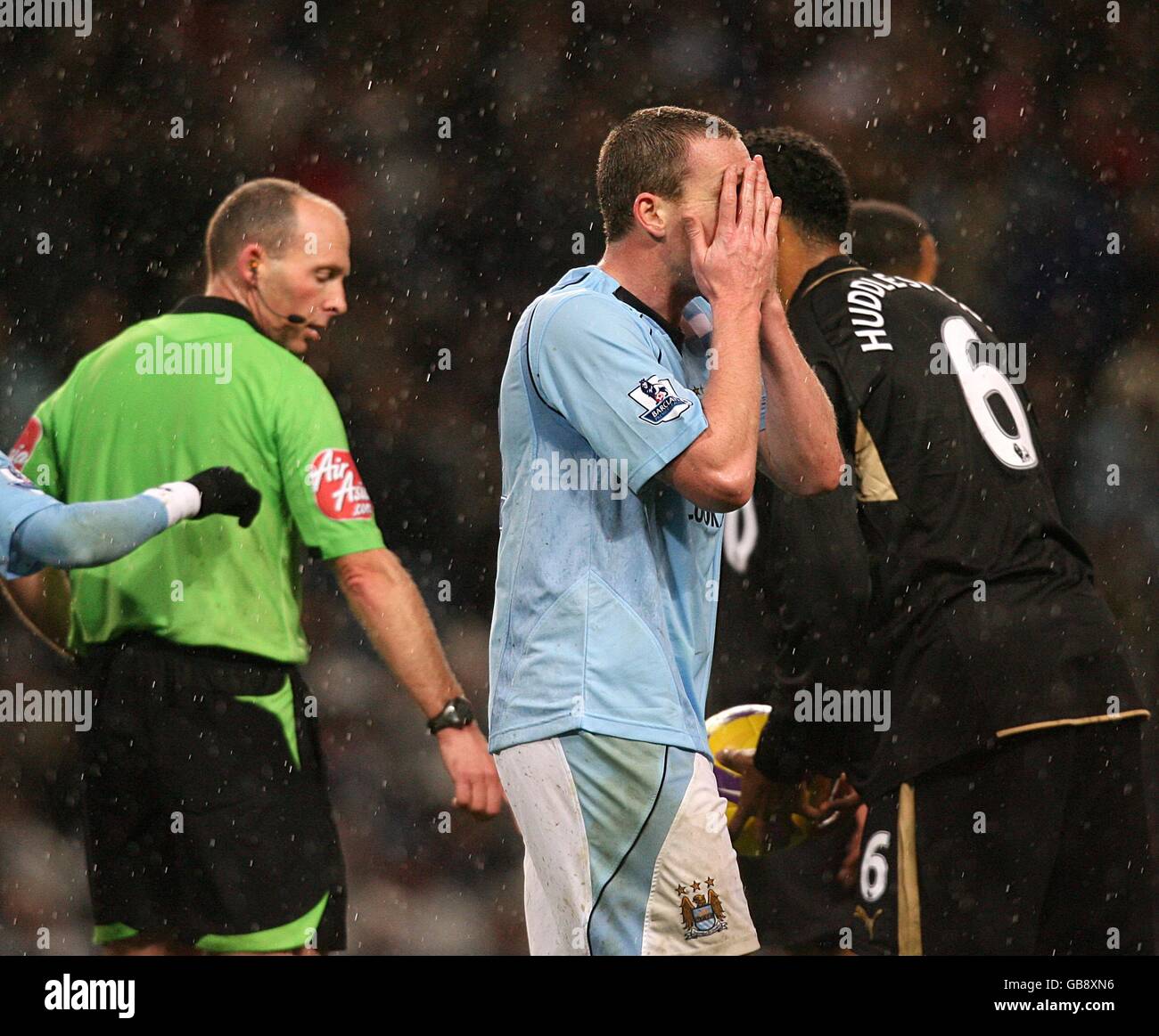Manchester City's Richard Dunne leaves the field dejected after he is ...