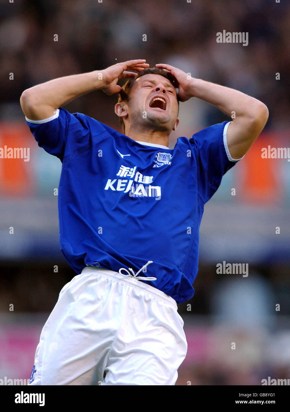 Everton's Tomasz Radzinski shows his reaction to missing an early goal ...