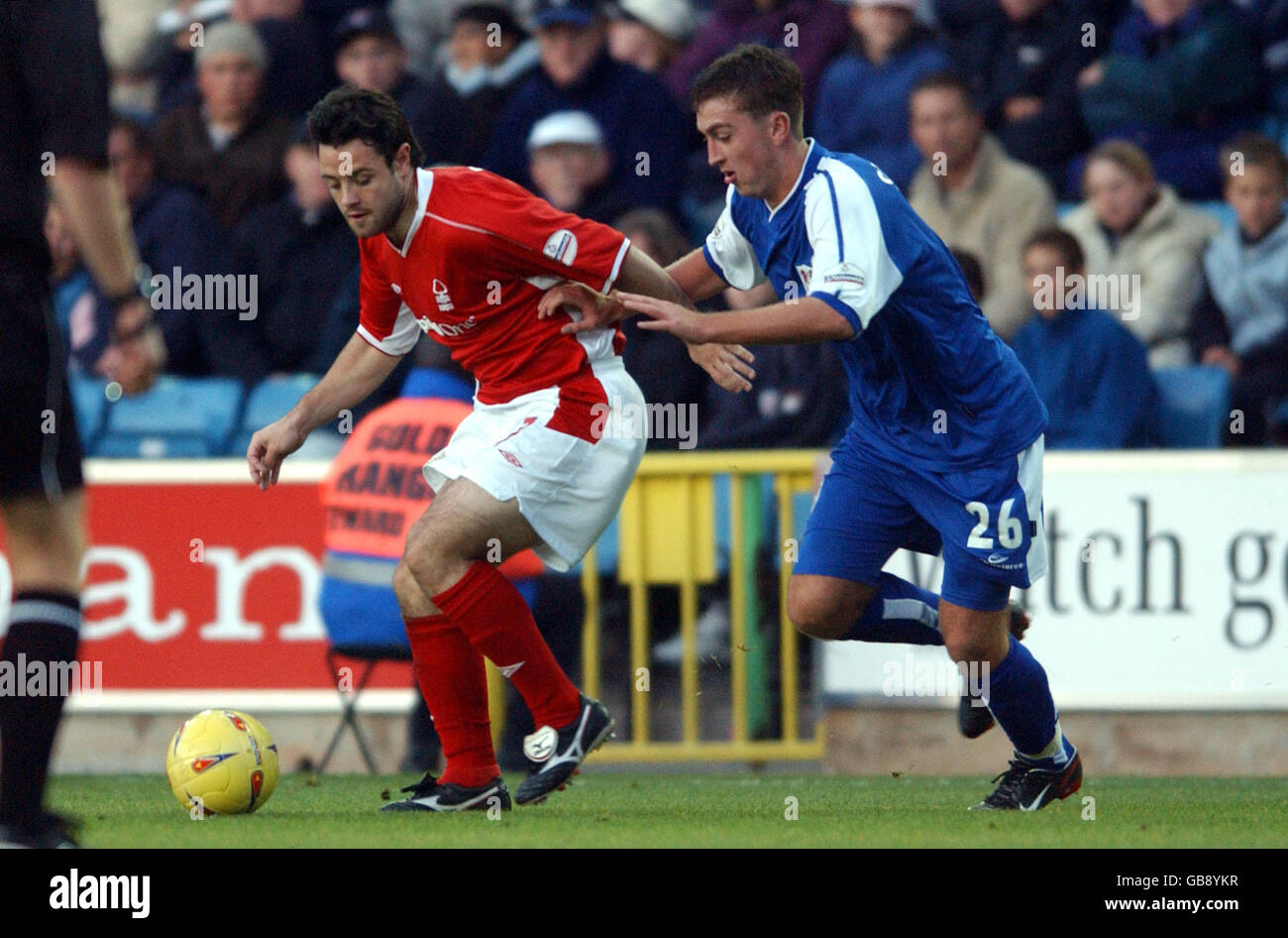 l-r; Nottingham Forest's Andy Reid holds off Millwall's Peter Sweeney ...