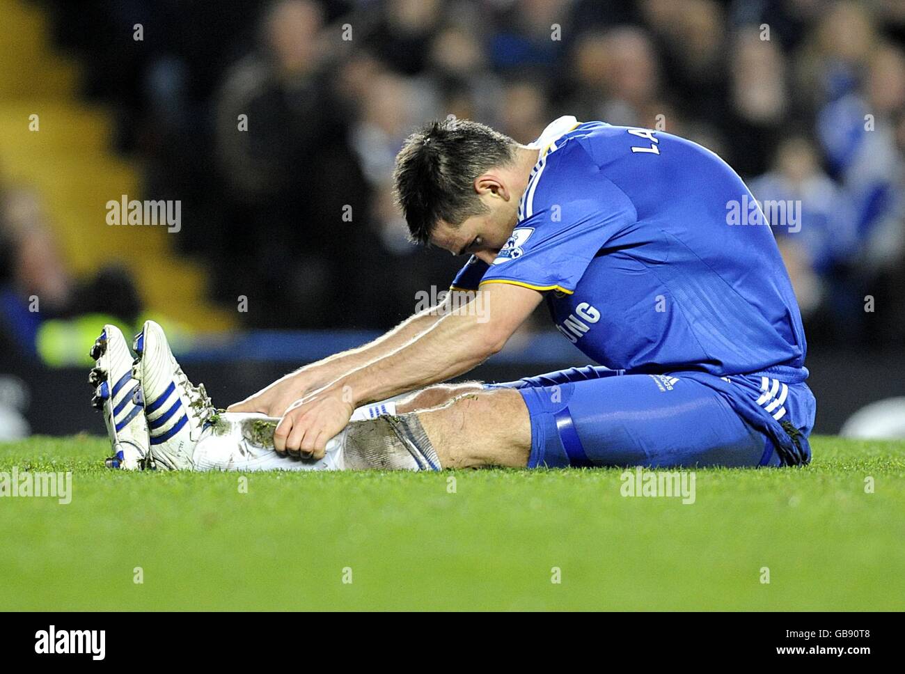 Full length holding legs football datacoapplies hi-res stock ...