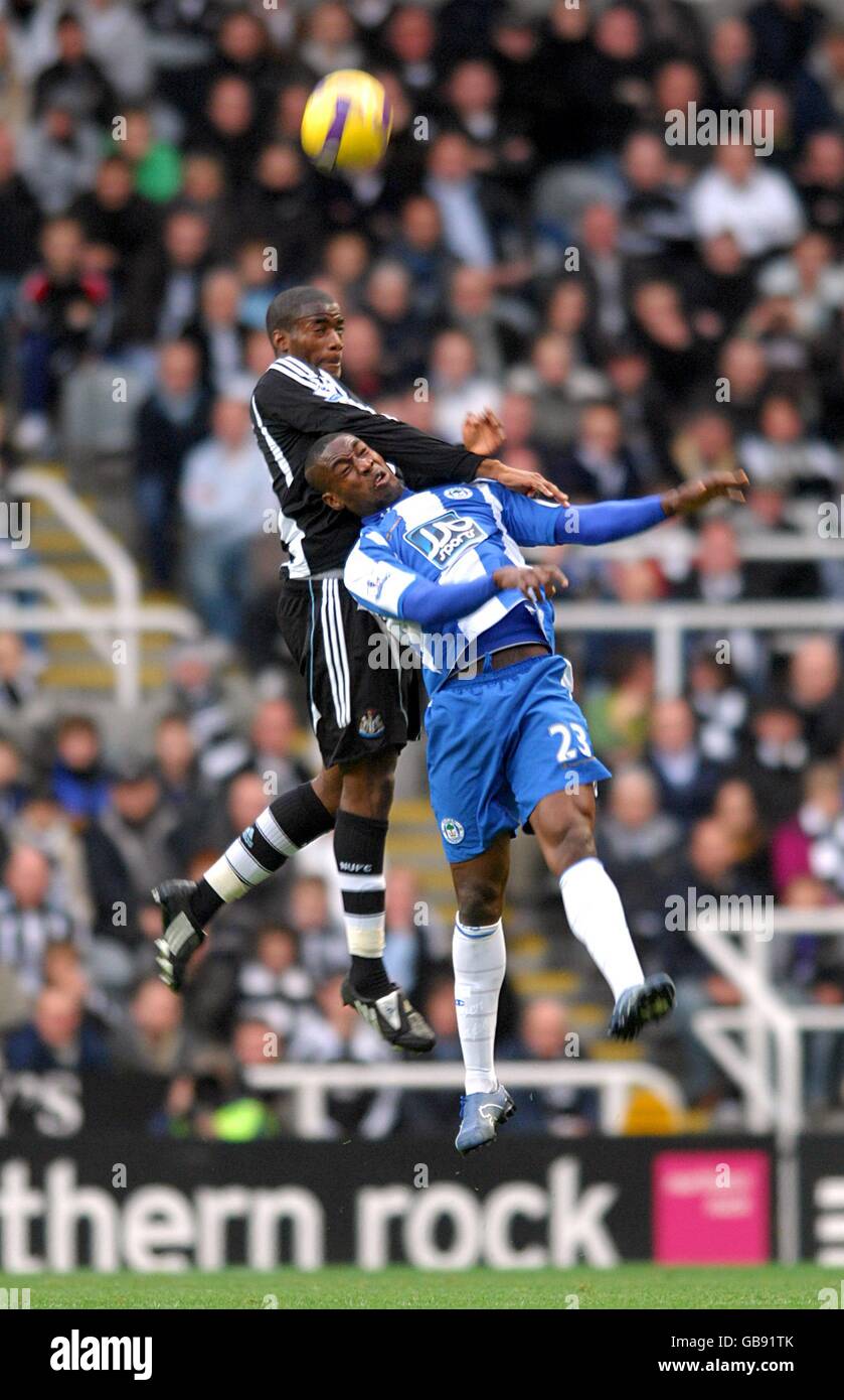 Newcastle United's Sebastien Bassong and Wigan Athletic's Olivier Kapo ...