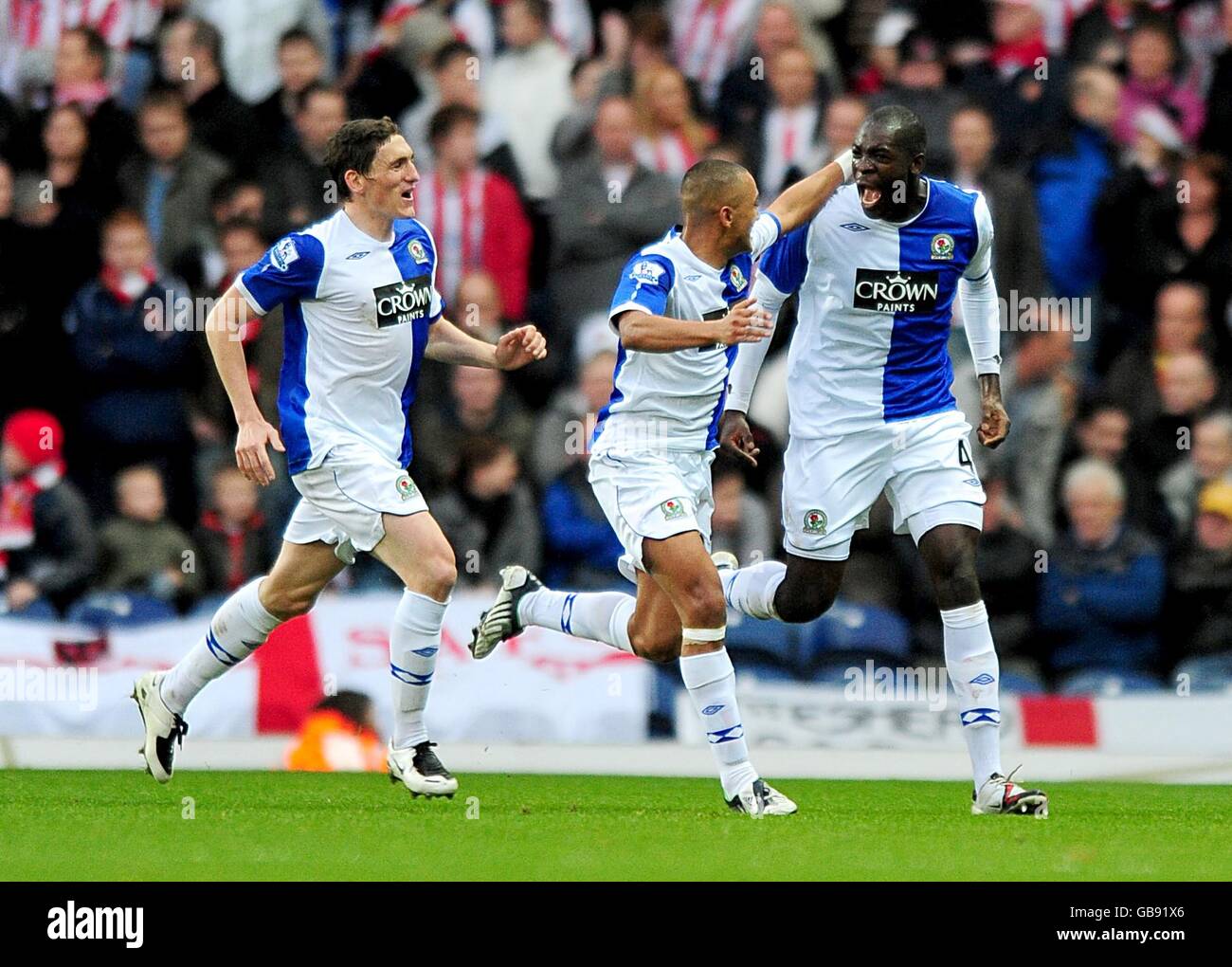 Blackburn Rovers' Christopher Samba (r) is congratulated by his team ...
