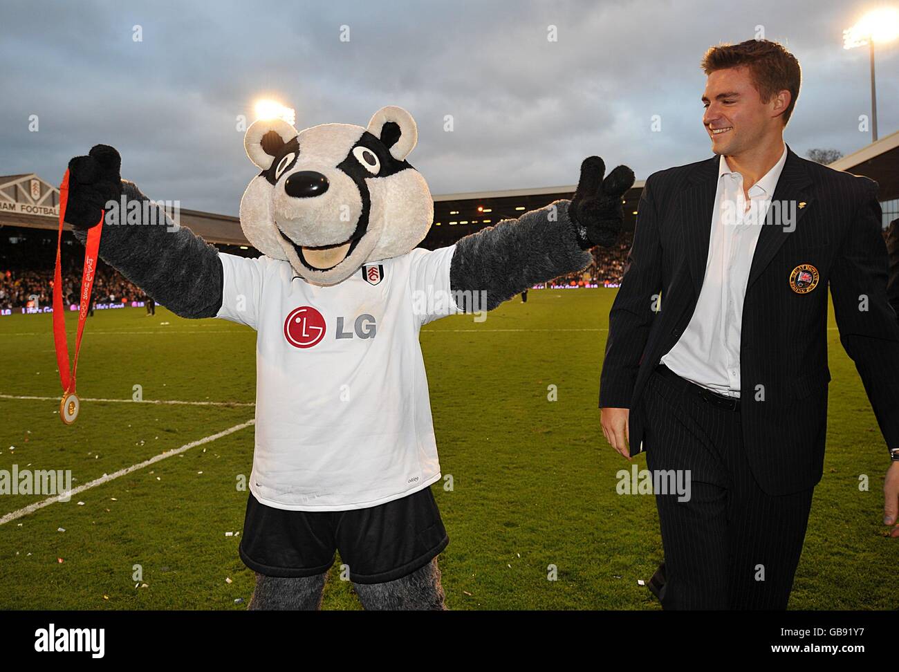 Fulham mascot Billy the Badger, on the pitch with Beijing Olympic medal ...
