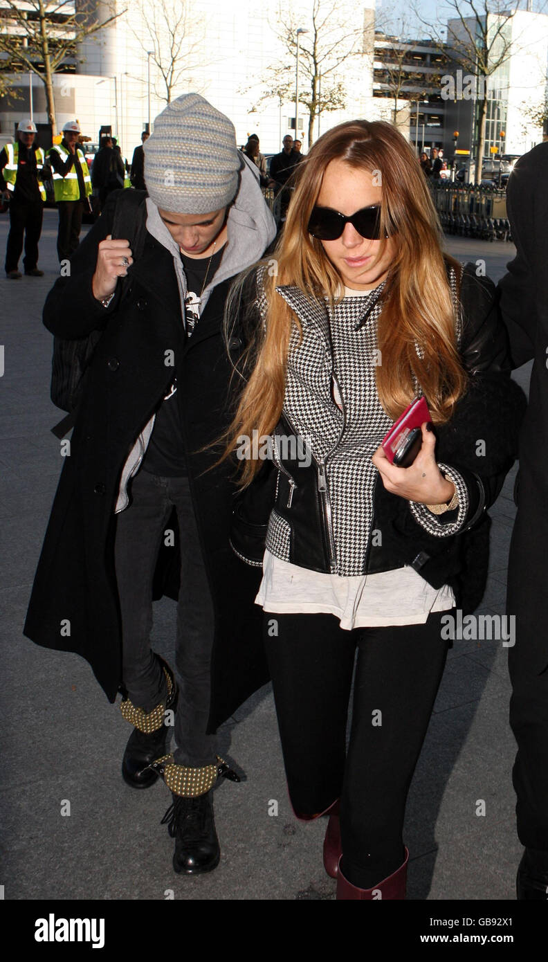 Lindsay Lohan (right) and Sam Ronson arrive at Heathrow Airport to ...