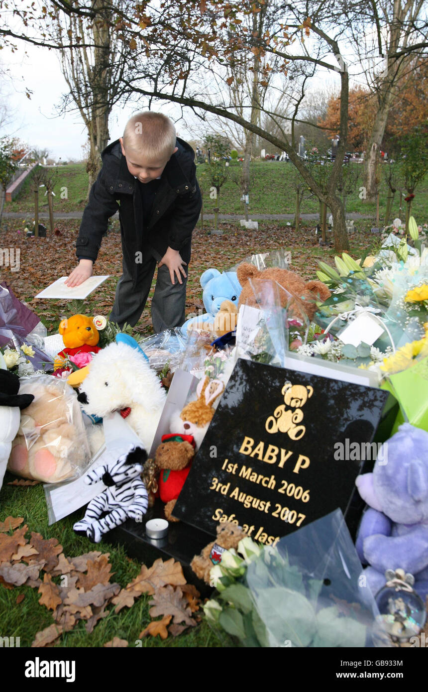 Five-year-old Nathan Fox, from Chingford in Essex, sets down a card as ...