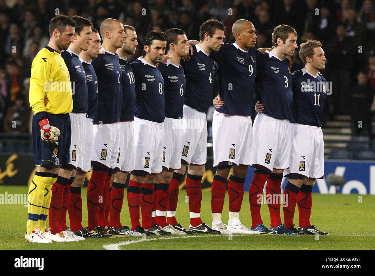 The Scotland team observe a minutes silence in honour of former ...