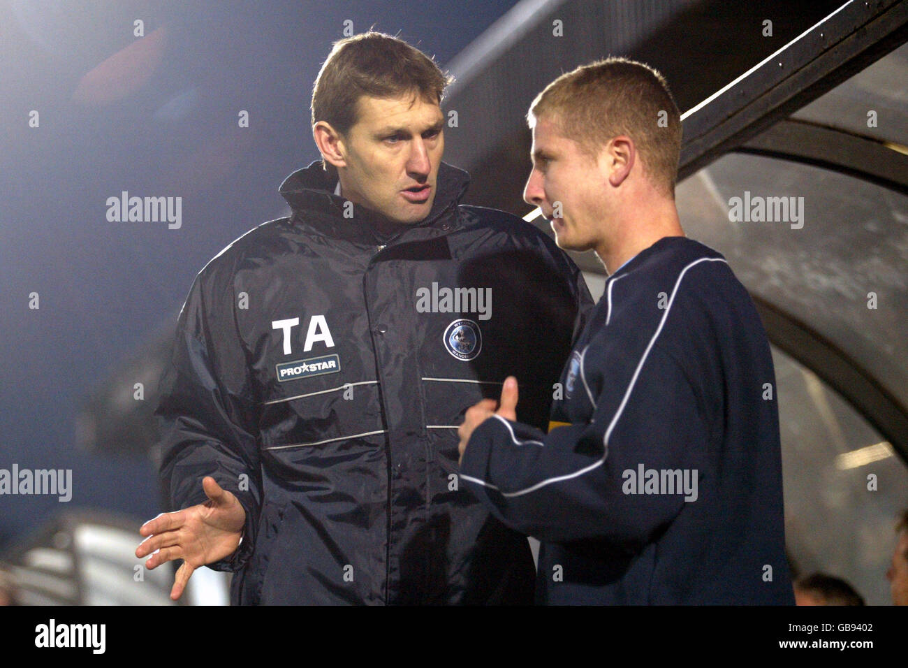Wycombe Wanderers manager Tony Adams (l) gives instructions to Charlie ...