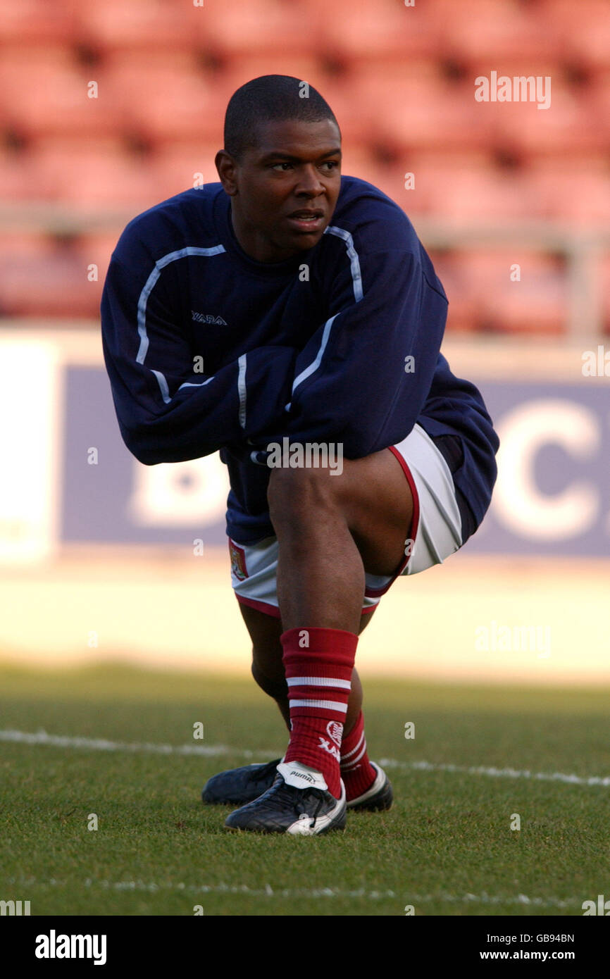 Northampton Town's Des Lyttle stretches off during the warm up Stock ...