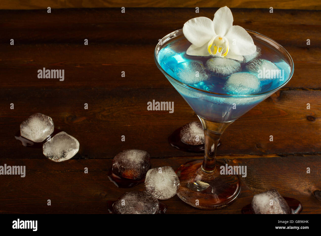 Cocktail Blue Martini on the dark wooden background. Blue cocktail ...